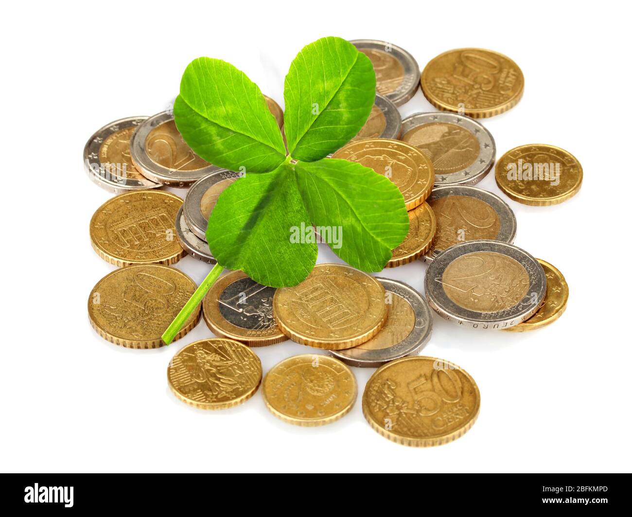 Clover leaf and euro coins isolated on white Stock Photo - Alamy