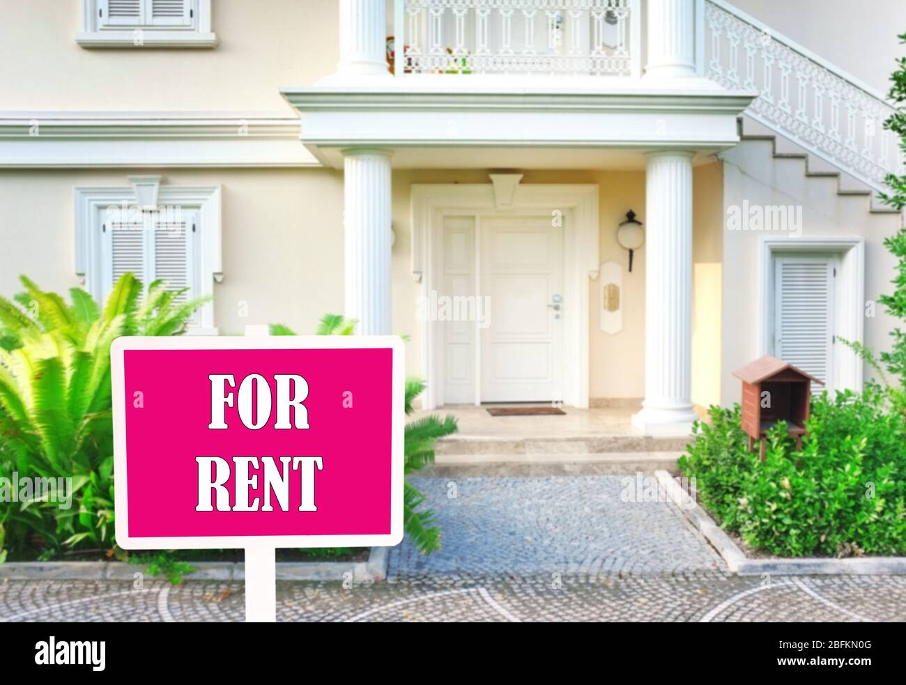 Real estate sign in front of new house for rent Stock Photo - Alamy