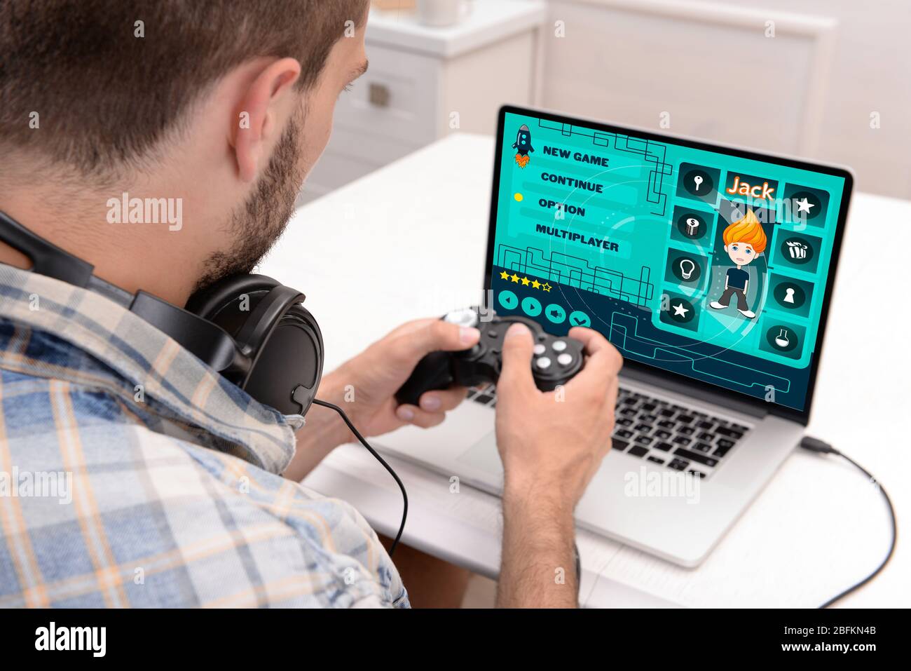 Young man playing computer games at home Stock Photo - Alamy