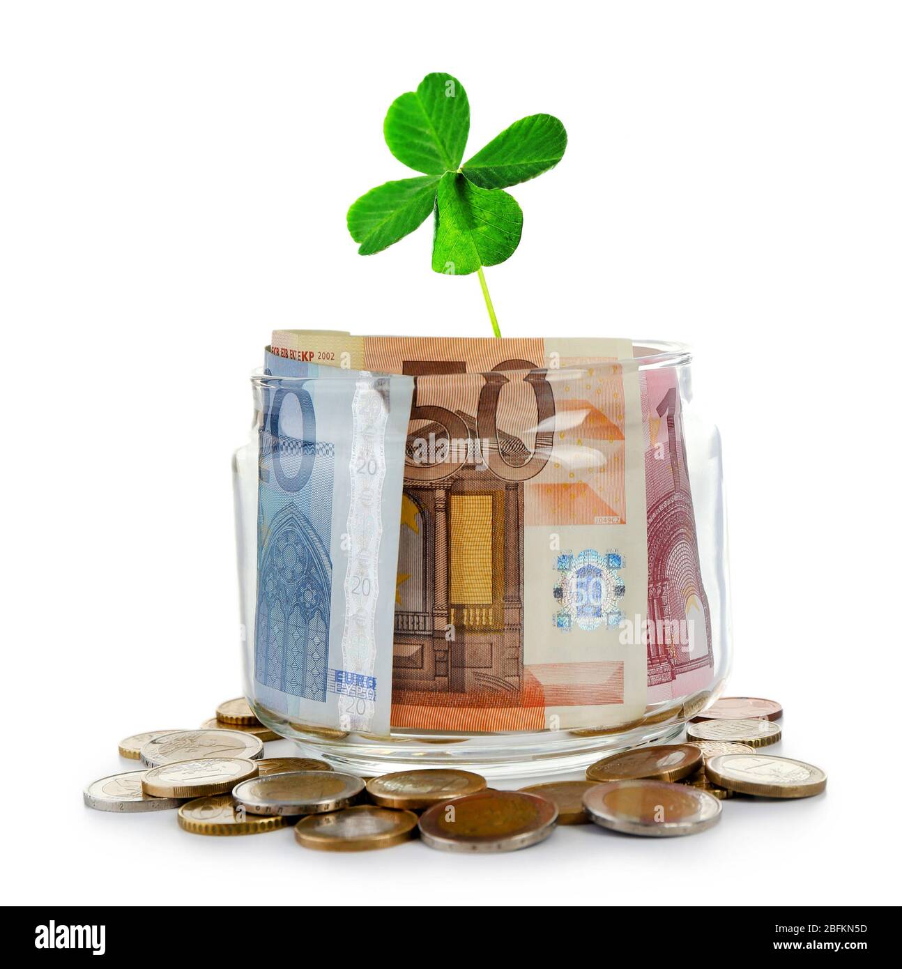 Clover leaf and money isolated on white Stock Photo - Alamy