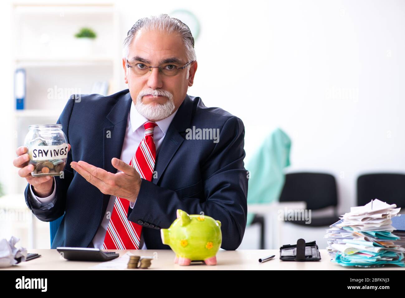 Old accountant in budget planning concept Stock Photo - Alamy