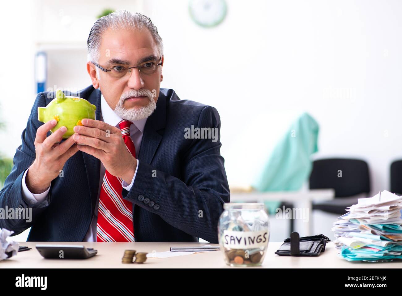 Old accountant in budget planning concept Stock Photo - Alamy