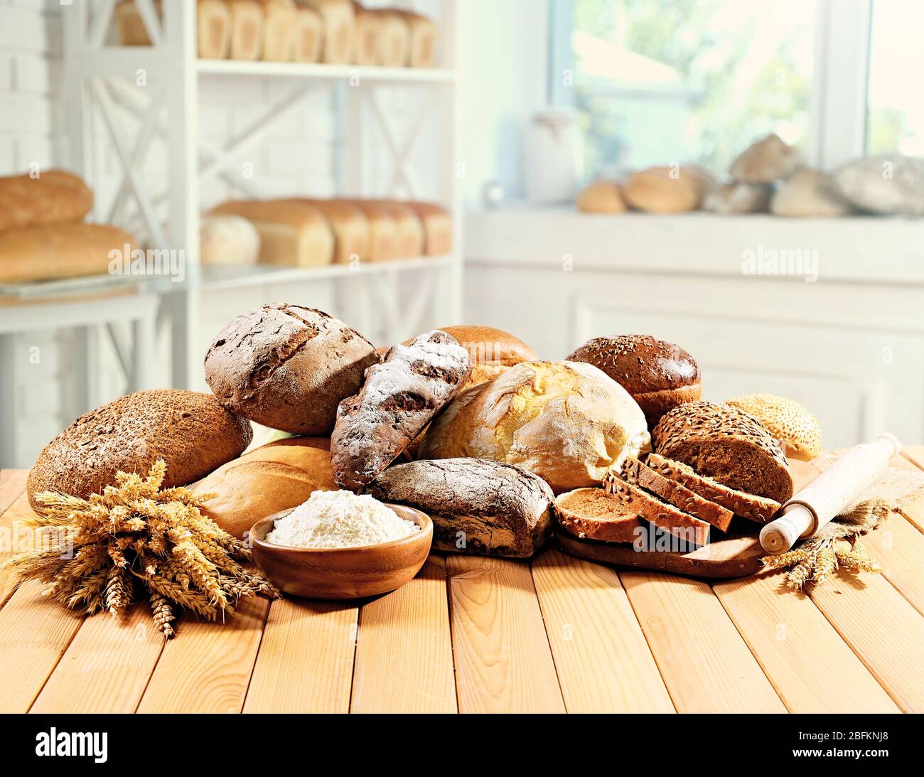 Fresh bread on wooden table indoors Stock Photo - Alamy