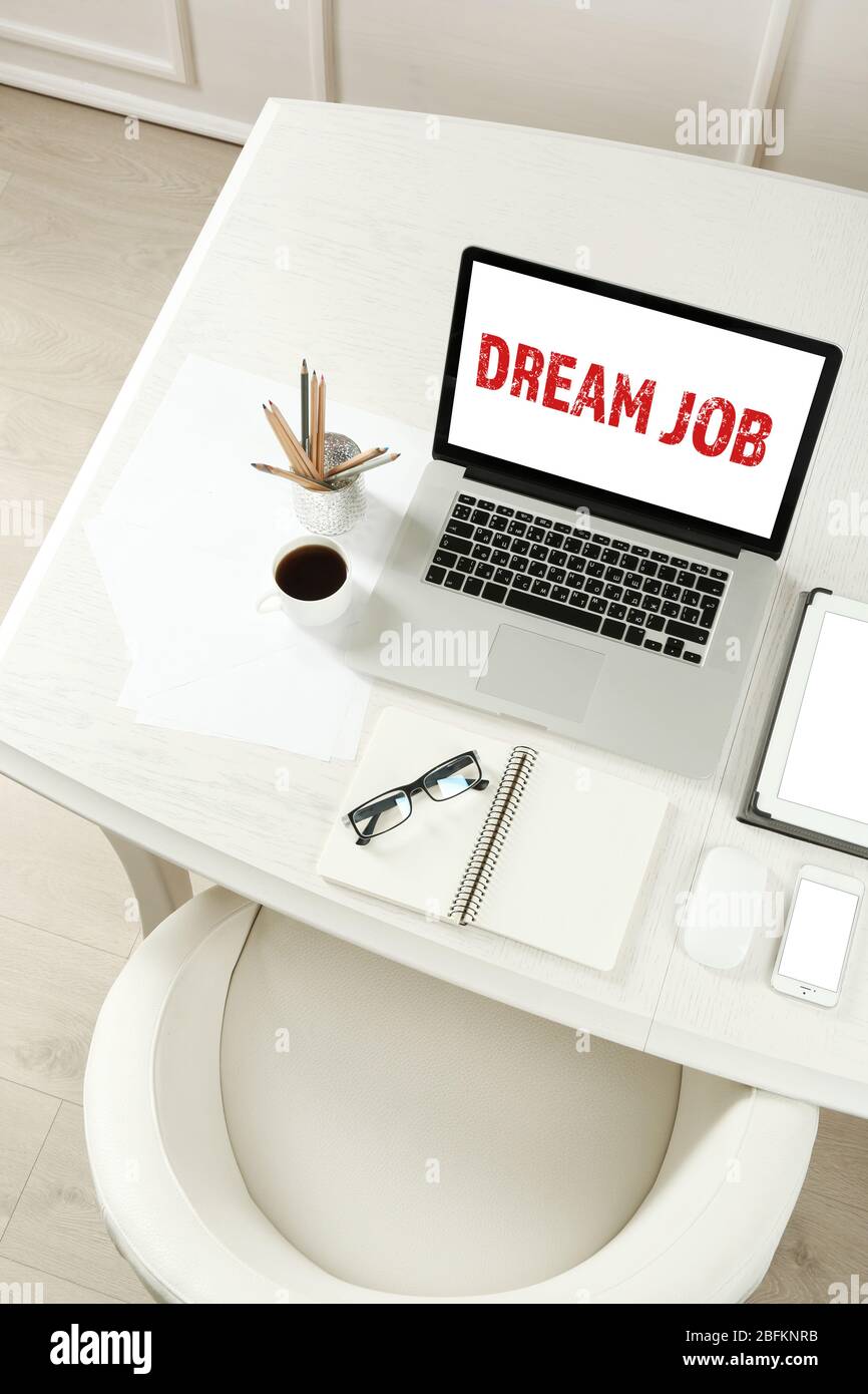 Dream job concept. Workplace with laptop in room Stock Photo - Alamy