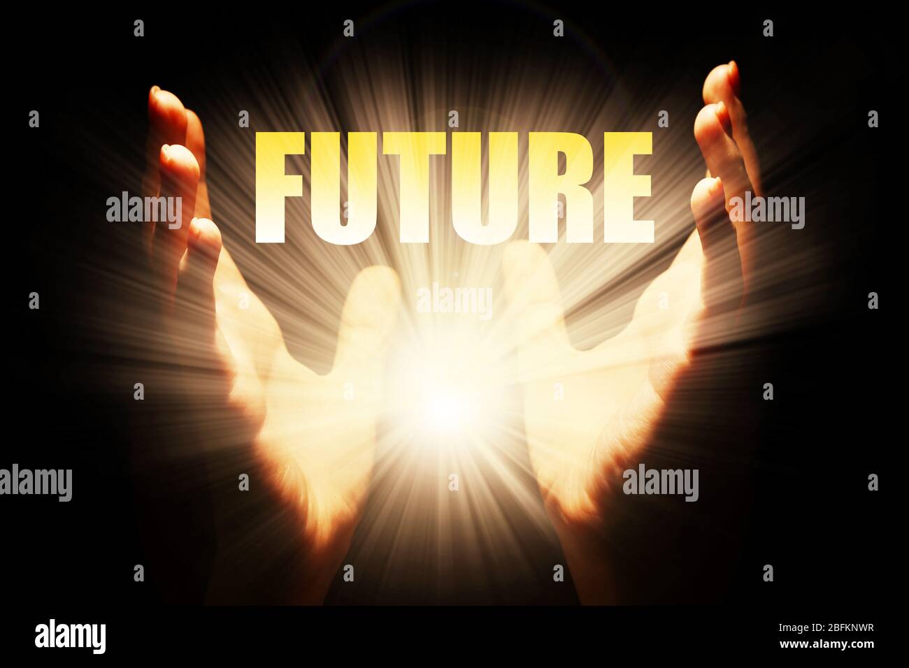 Future concept. Future word with light rays in hands on dark background ...
