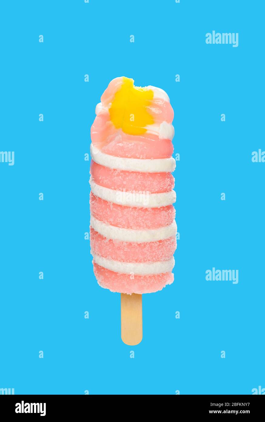 mango flavor popsicle with a bite on a blue background Stock Photo - Alamy