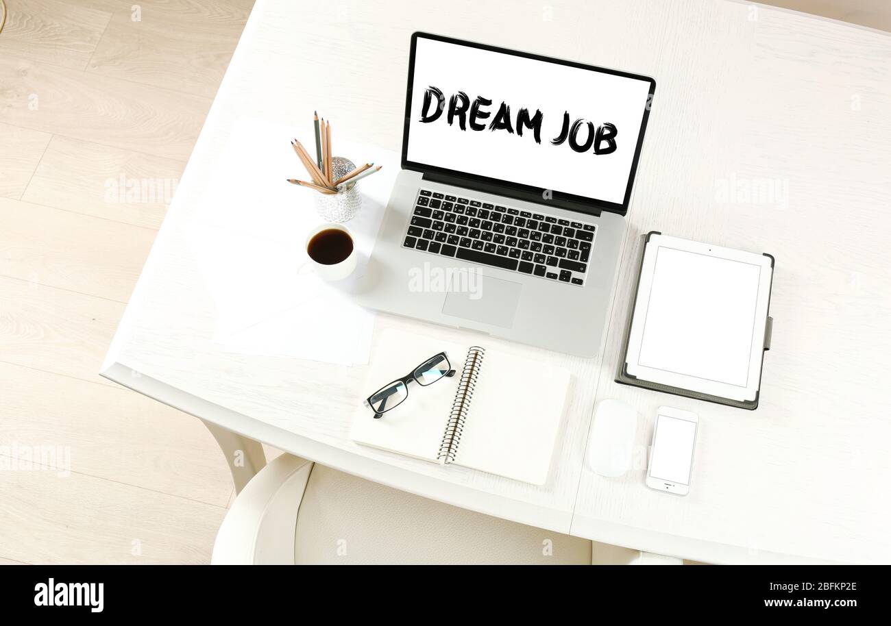 Dream job concept. Laptop with tablet and smart phone on Workplace top ...