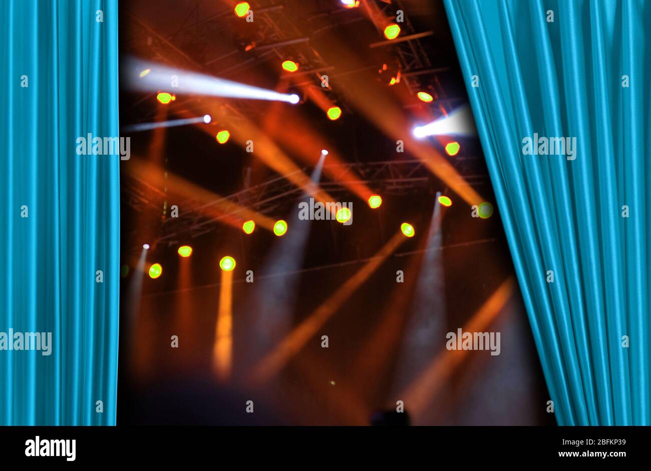 Blue curtain on concert stage slightly open Stock Photo - Alamy