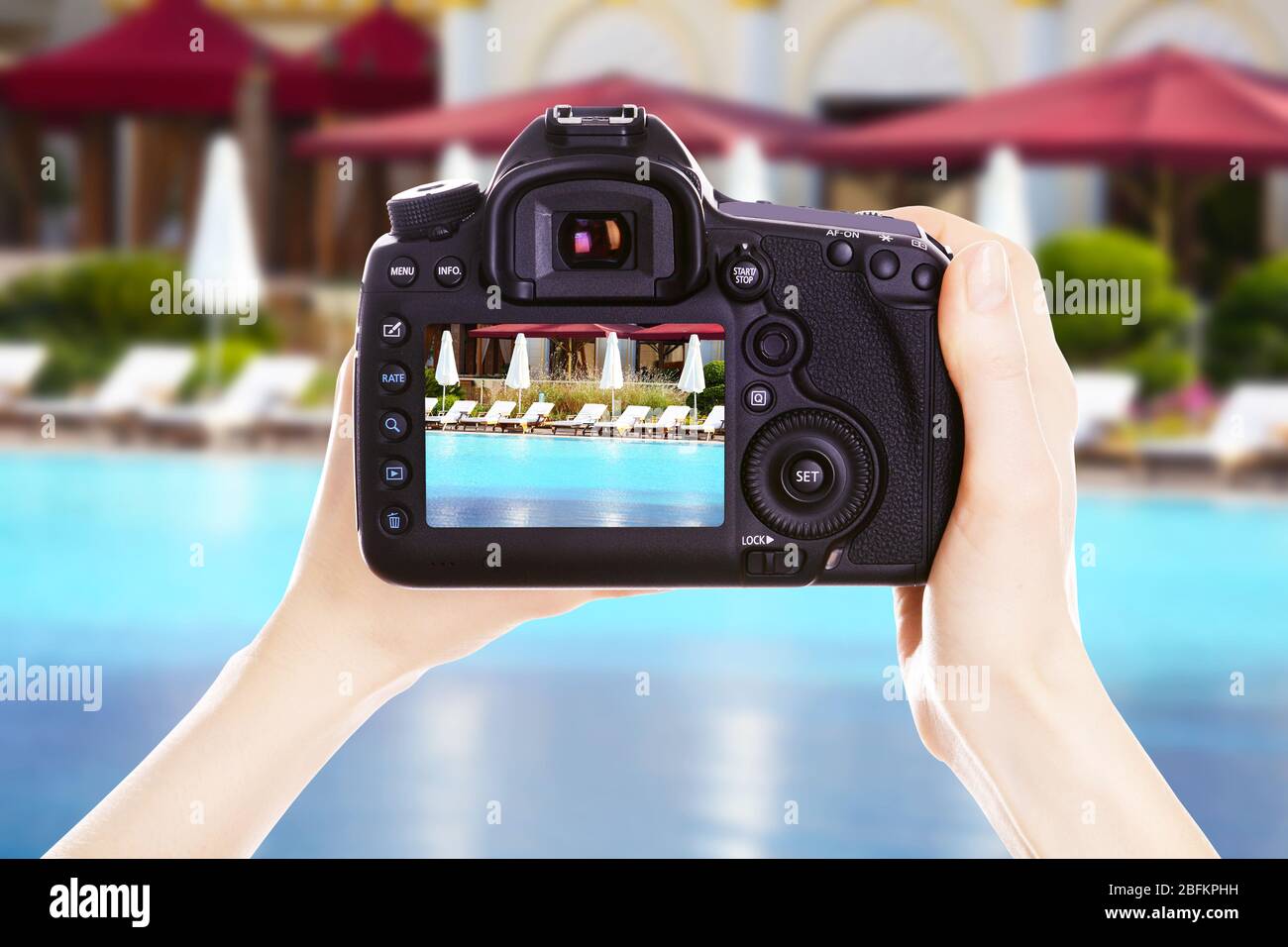 Photographer with camera at work Stock Photo - Alamy