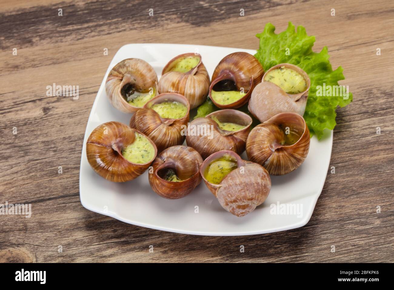 French cuisine - Escargot with butter sauce Stock Photo - Alamy