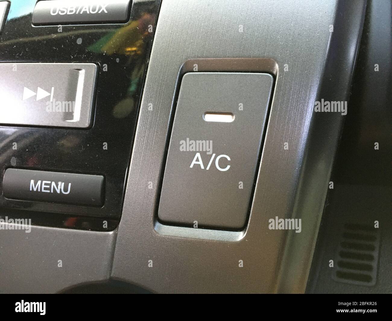 A/C button on the black dashboard of an old car Stock Photo - Alamy