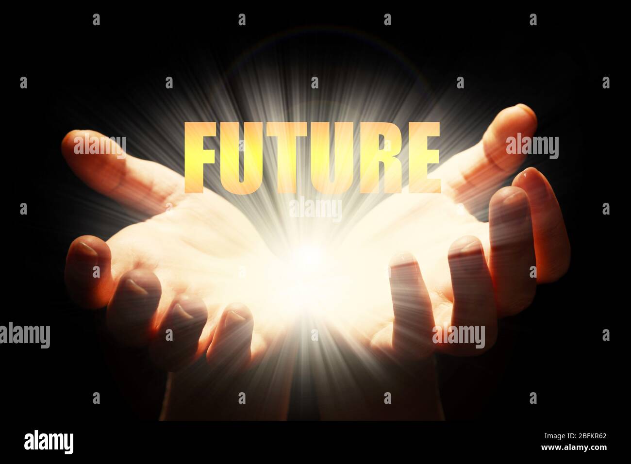 Future concept. Future word with light rays in hands on dark background ...