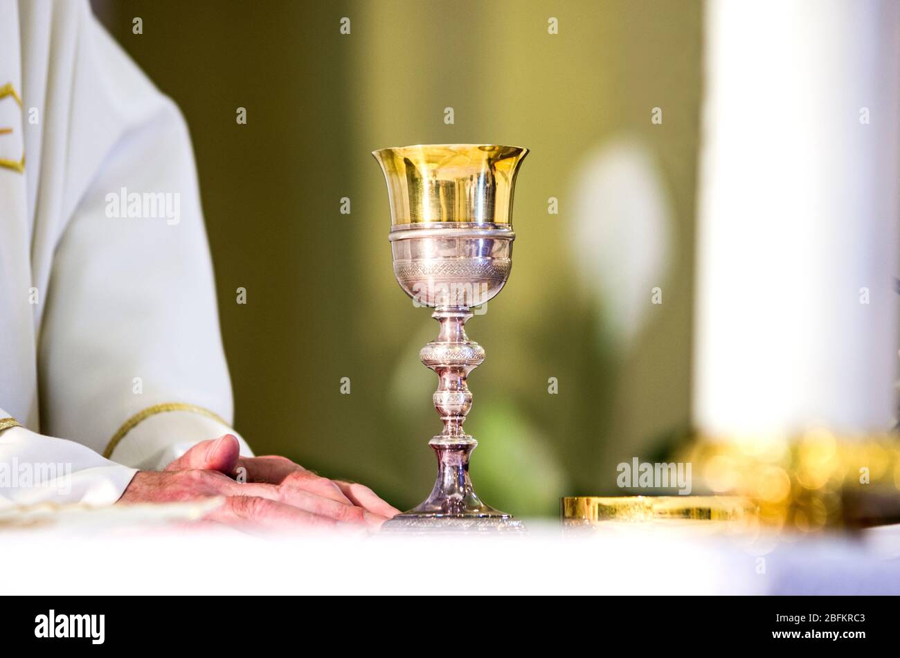 chalice with wine, consecrated in the blood of the risen Christ, ready ...
