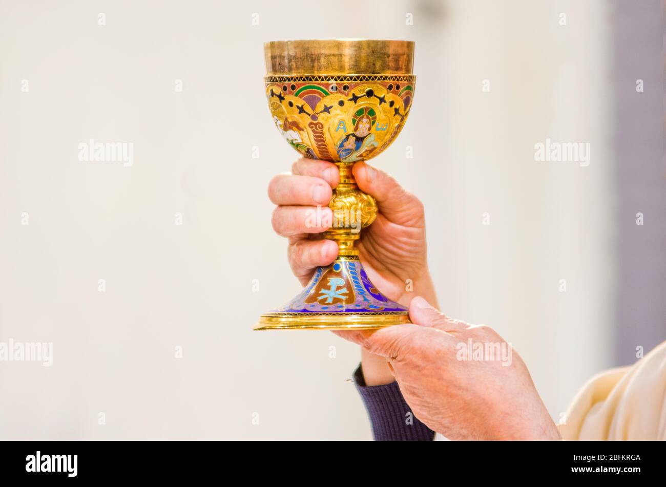 chalice with wine, consecrated in the blood of the risen Christ, ready ...