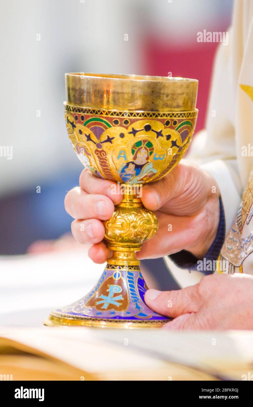 chalice with wine, consecrated in the blood of the risen Christ, ready ...