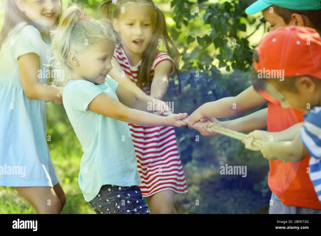 Happy active children playing in park Stock Photo - Alamy