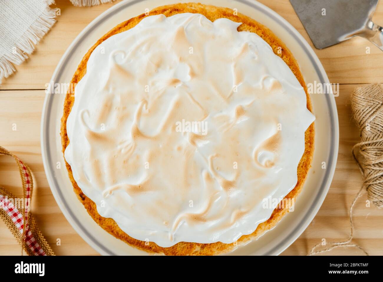 Top view of a delicious three milk cake on a pine wood background ...