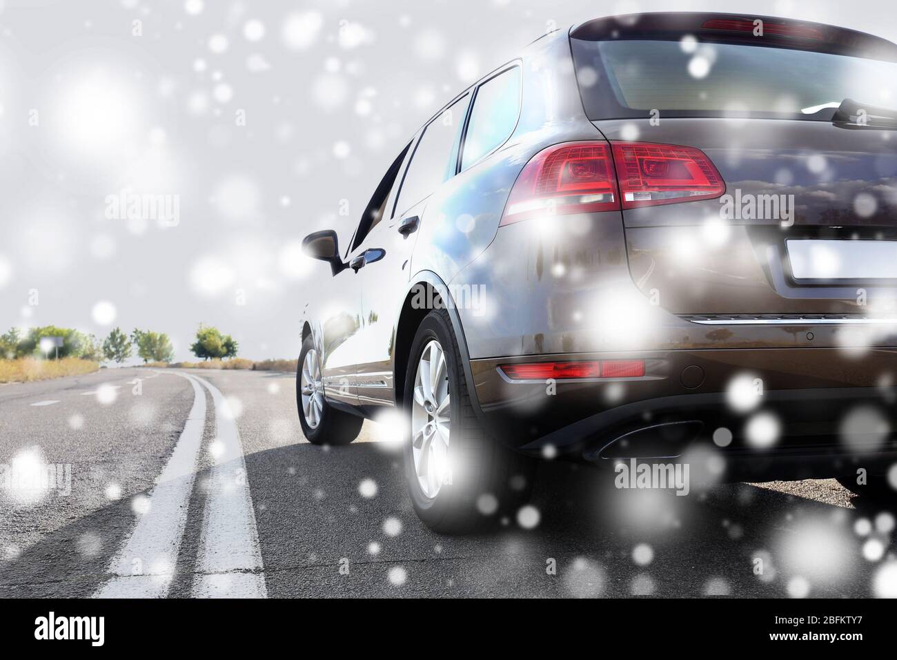 Car on road over snow effect Stock Photo - Alamy