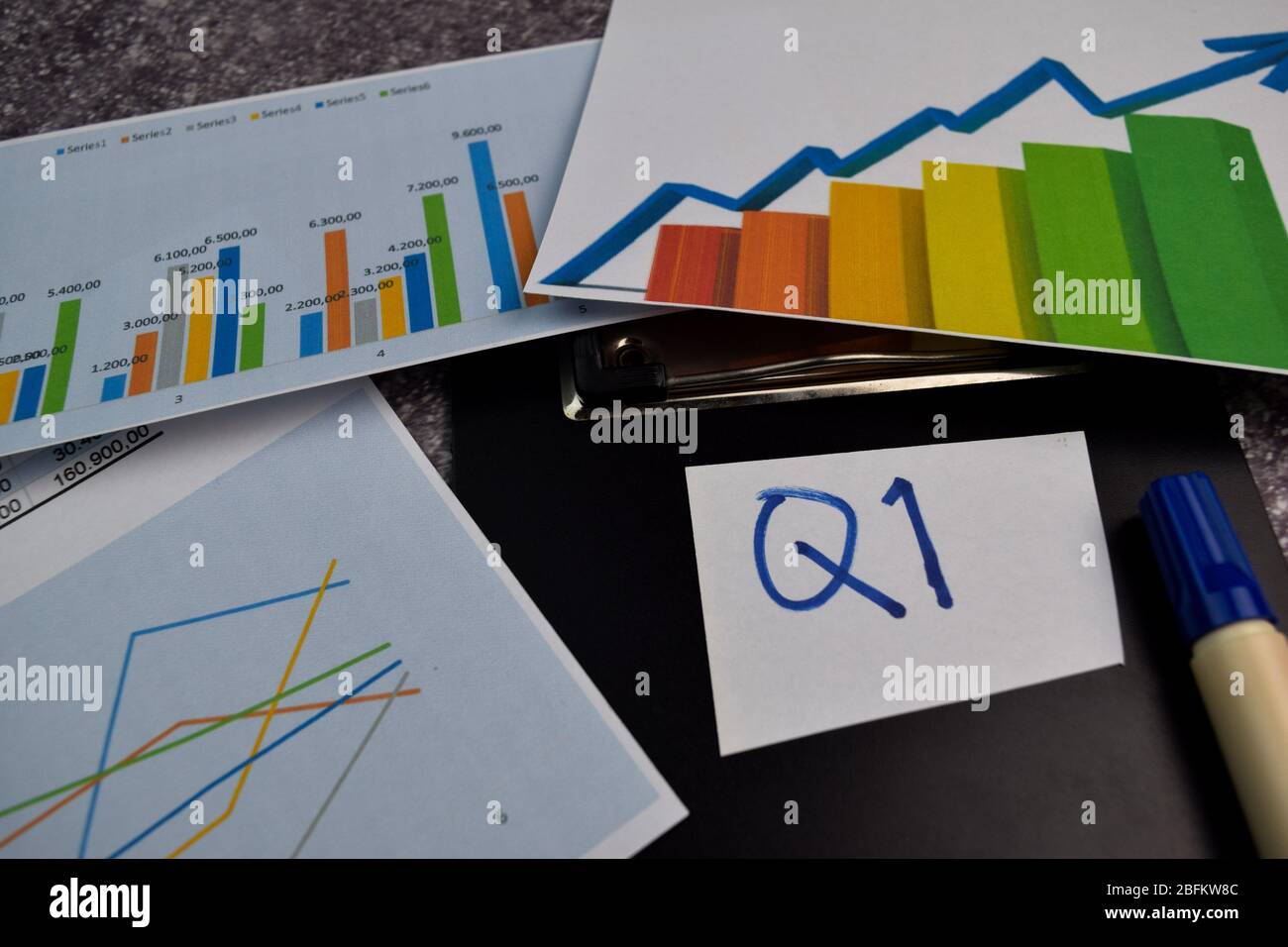 Q1 - 1st Quarter Period write on sticky notes isolated on Office Desk ...