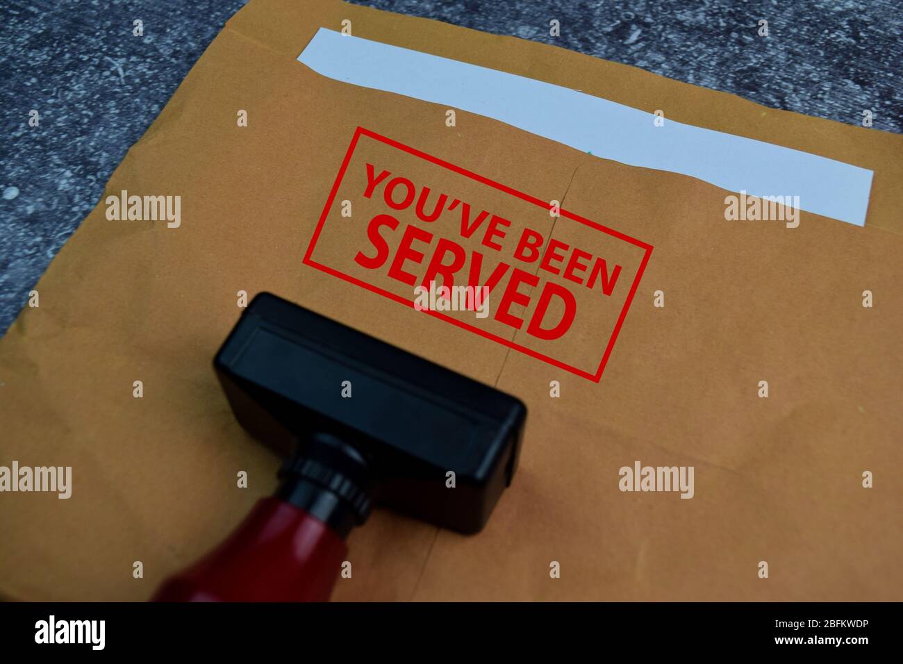 Red Handle Rubber Stamper and You've Been Served text isolated on the ...