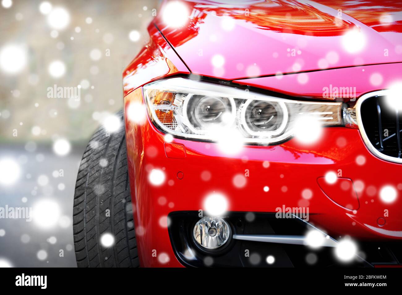 Red car, outdoors over snow effect Stock Photo - Alamy