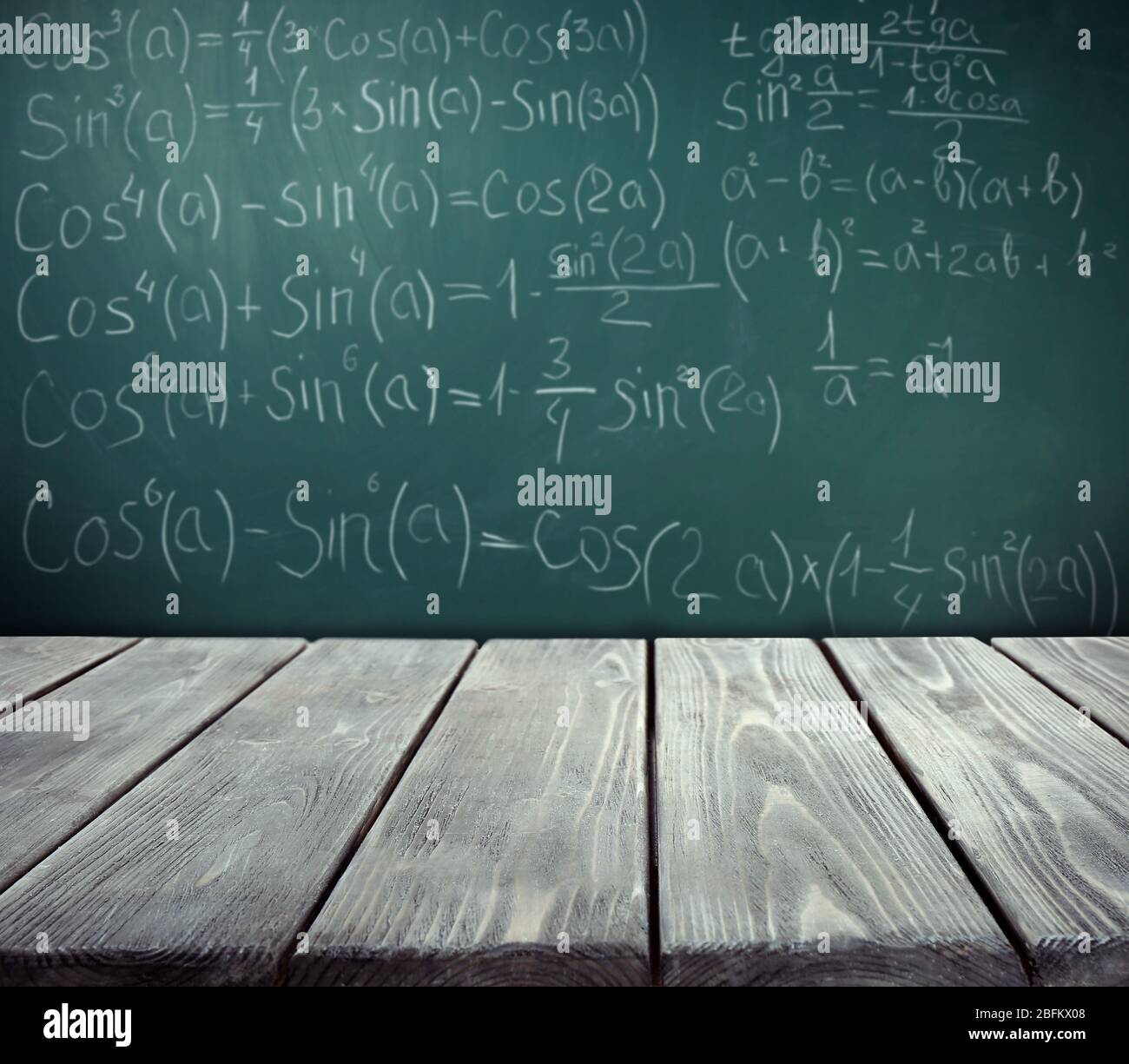 Desk and chalkboard - school background Stock Photo - Alamy