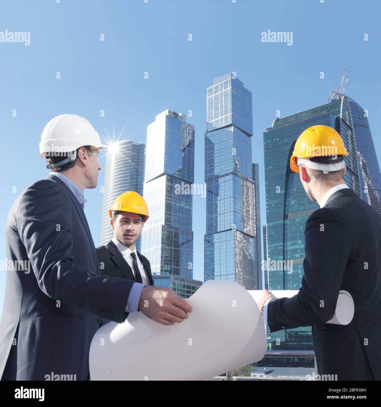 Engineering and architecture concept, engineers working on a building ...