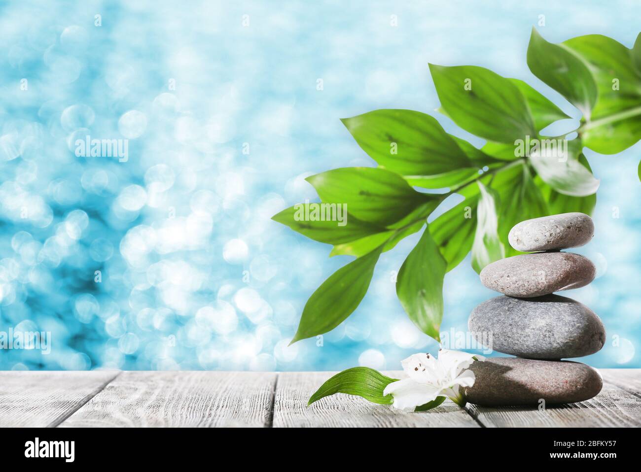 Still life of spa stones on bright background Stock Photo - Alamy