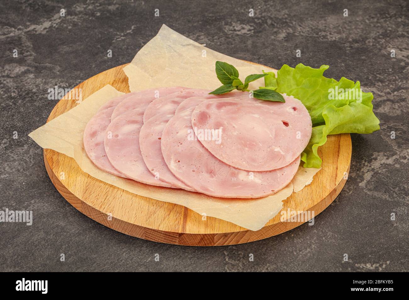 Slised ham pork snack over board Stock Photo - Alamy