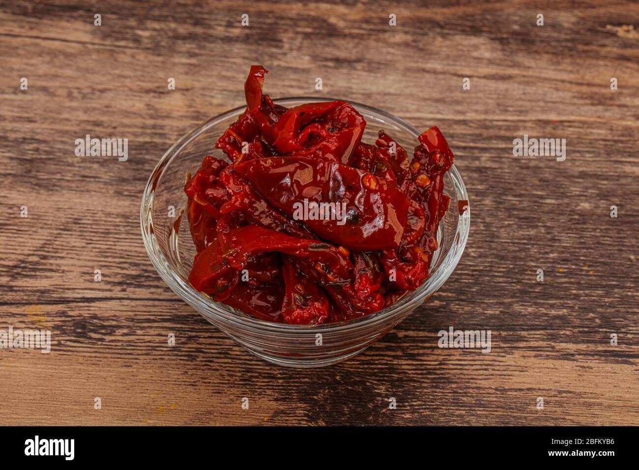 Dried tomato with olive oil and herbs Stock Photo - Alamy