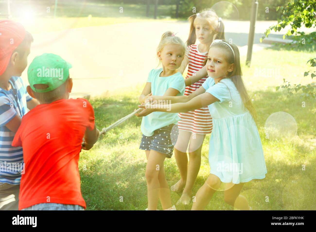 Happy active children playing in park Stock Photo - Alamy