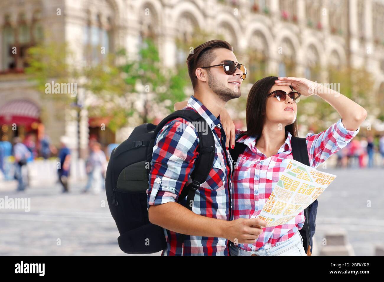 Happy tourists outside Stock Photo - Alamy