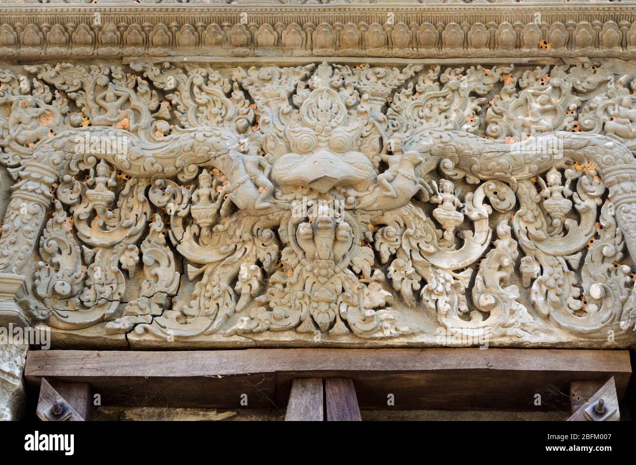 Garuda head and demon carvings on a lintel in Lolei ancient Hindu ...