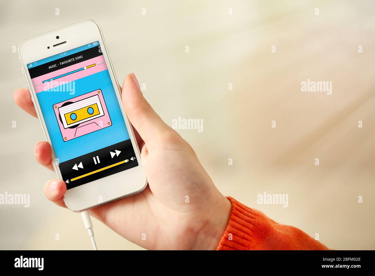 Music smartphone in female hand, on home interior background Stock ...