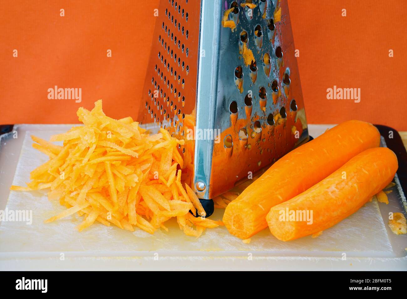 Grating fresh orange carrots hi-res stock photography and images - Alamy