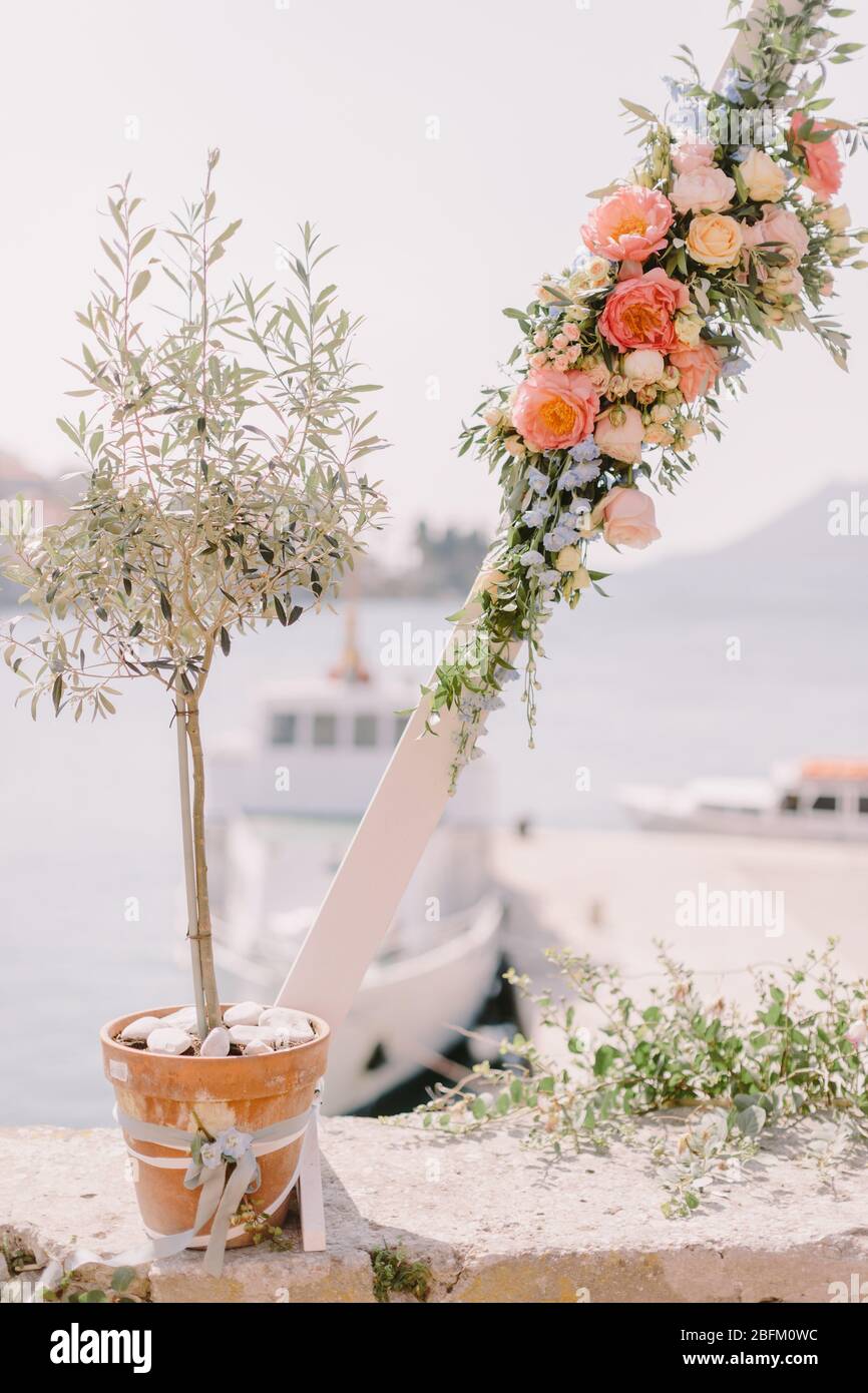 destination wedding arch with sea view. Triangle wedding arch in ...