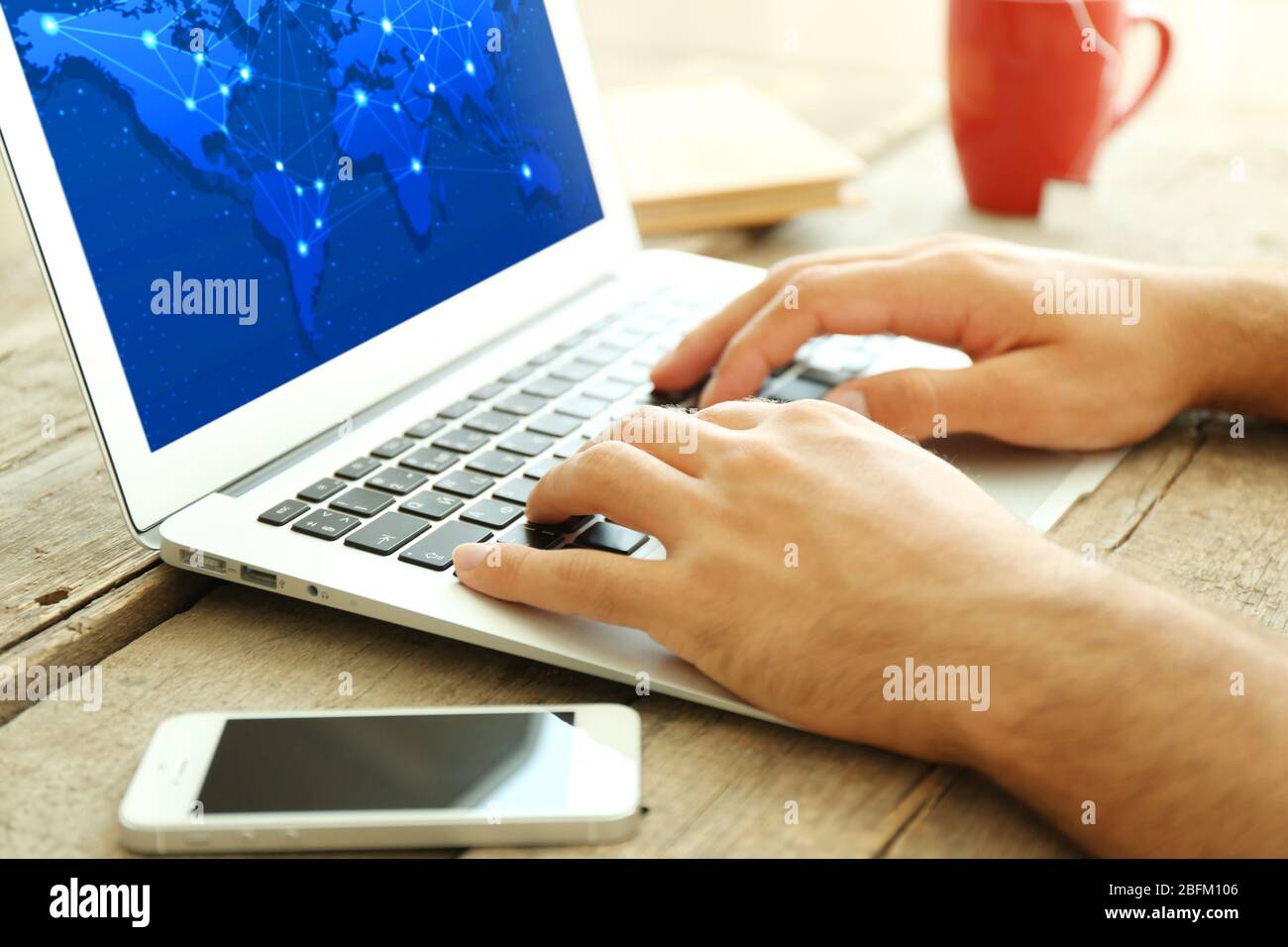 Human working with laptop, with world map and network on screen Stock ...