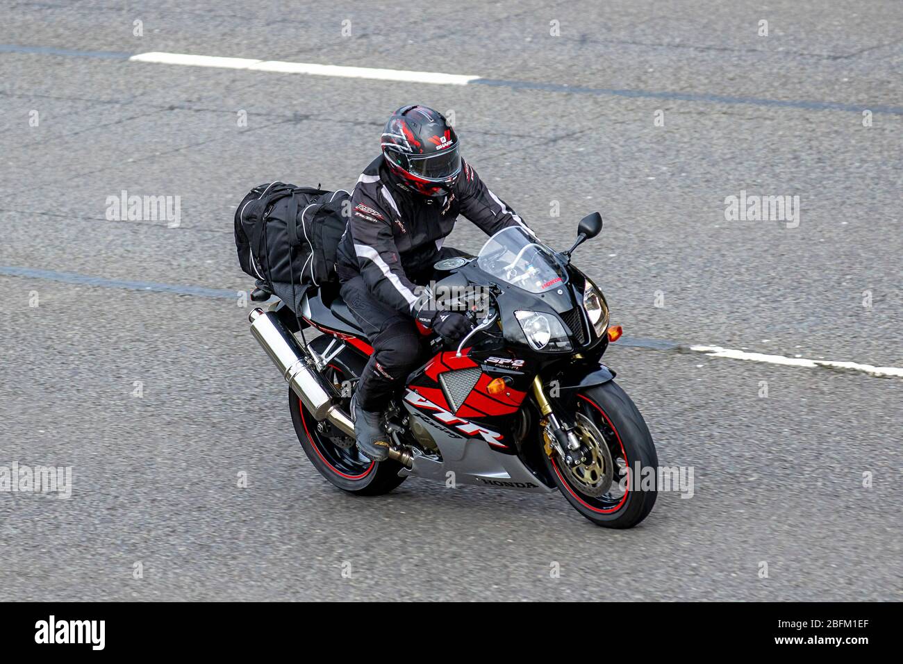 Honda vtr sp2 racing; Motorbike rider; two wheeled transport ...