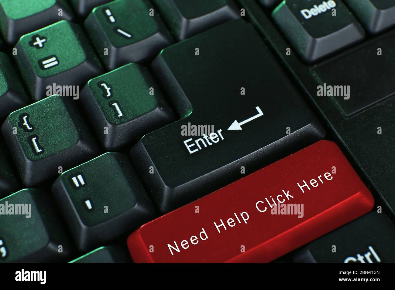 Close-up of laptop keyboard with color button and text Need help click ...