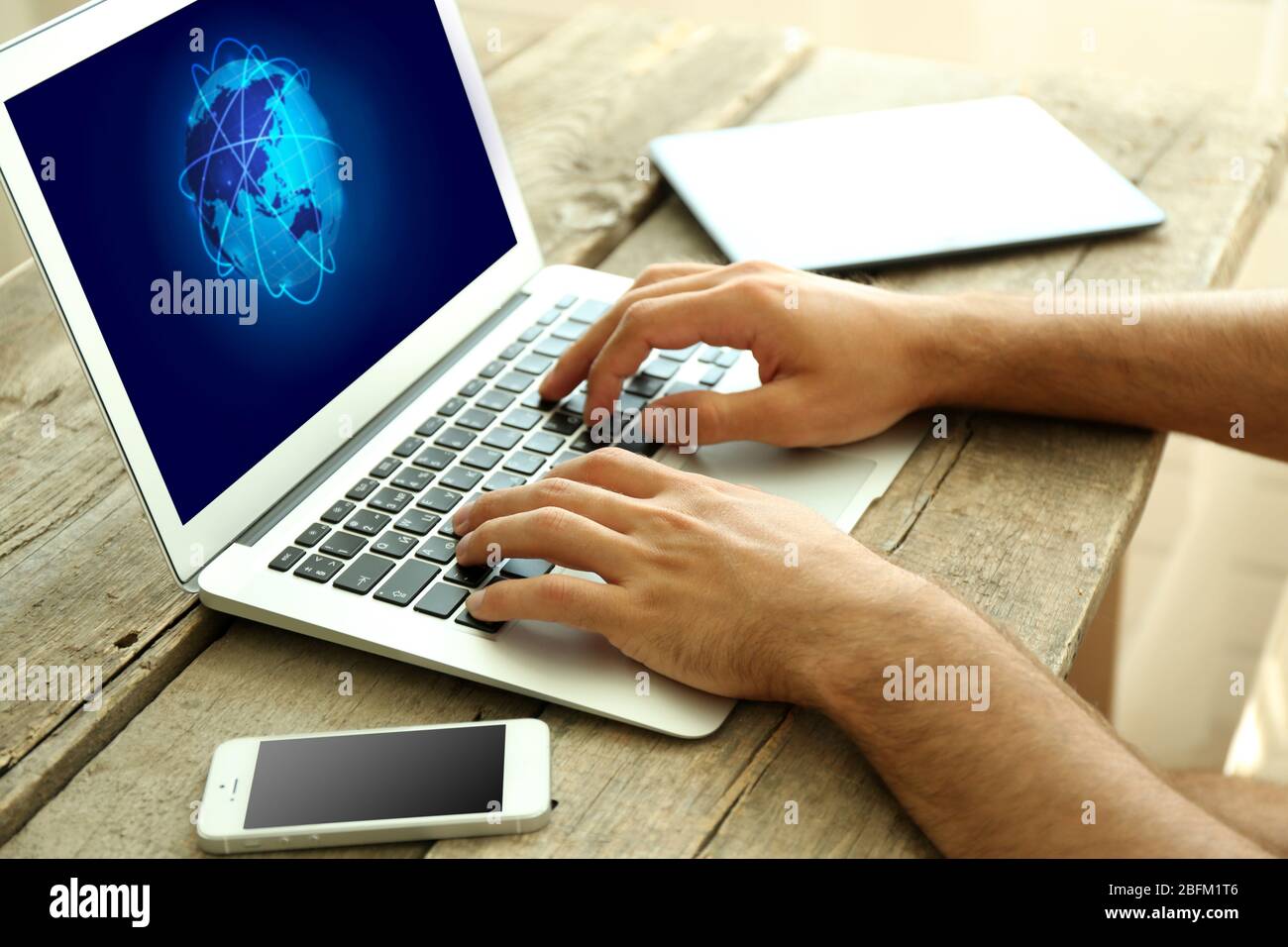 Human working with laptop, with world map and network on screen Stock ...