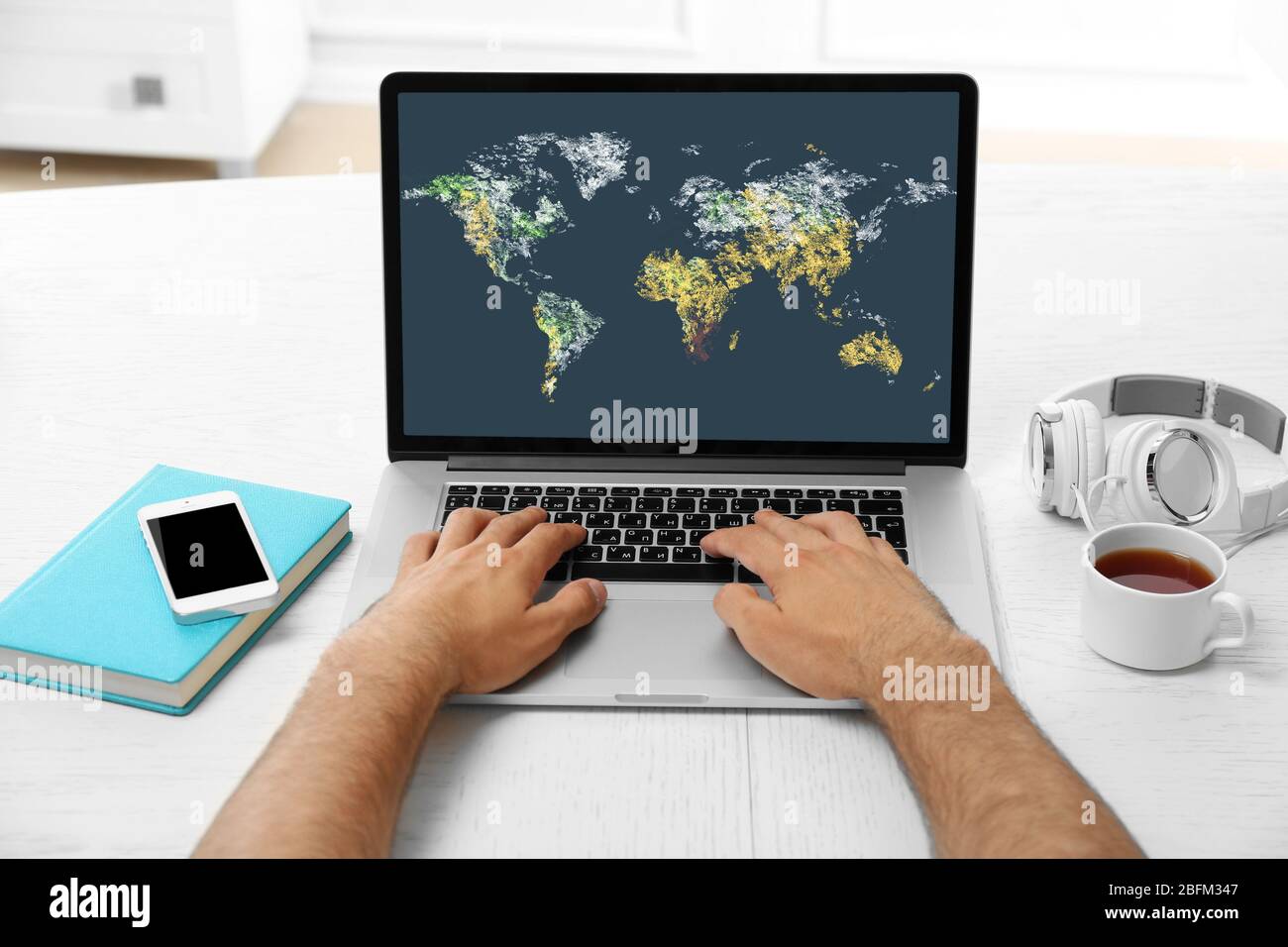 Human working with laptop, with world map and network on screen Stock ...