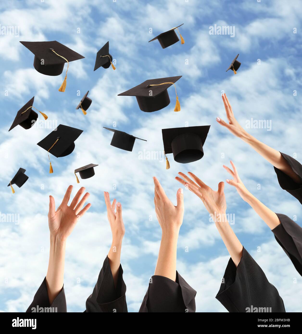 Graduate throwing hats cloud hi-res stock photography and images - Alamy