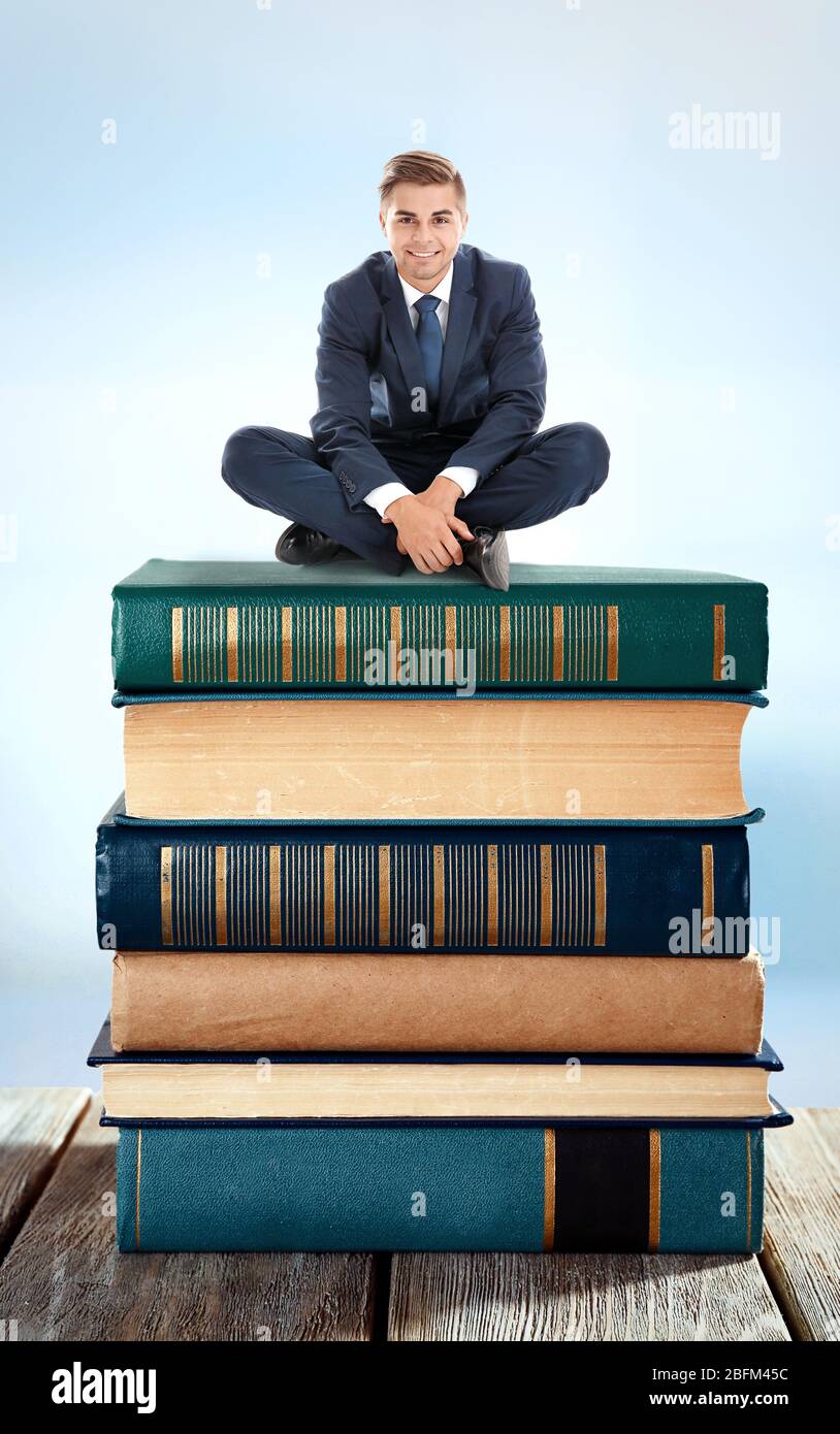 Man sitting on paper stack hi-res stock photography and images - Alamy