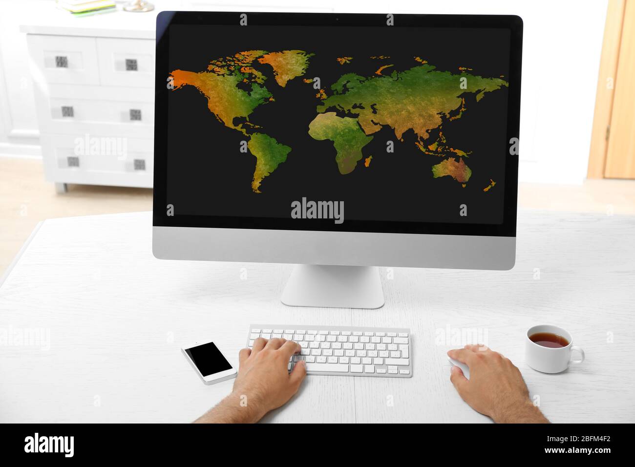 Human working with pc, with world map and network on screen Stock Photo ...