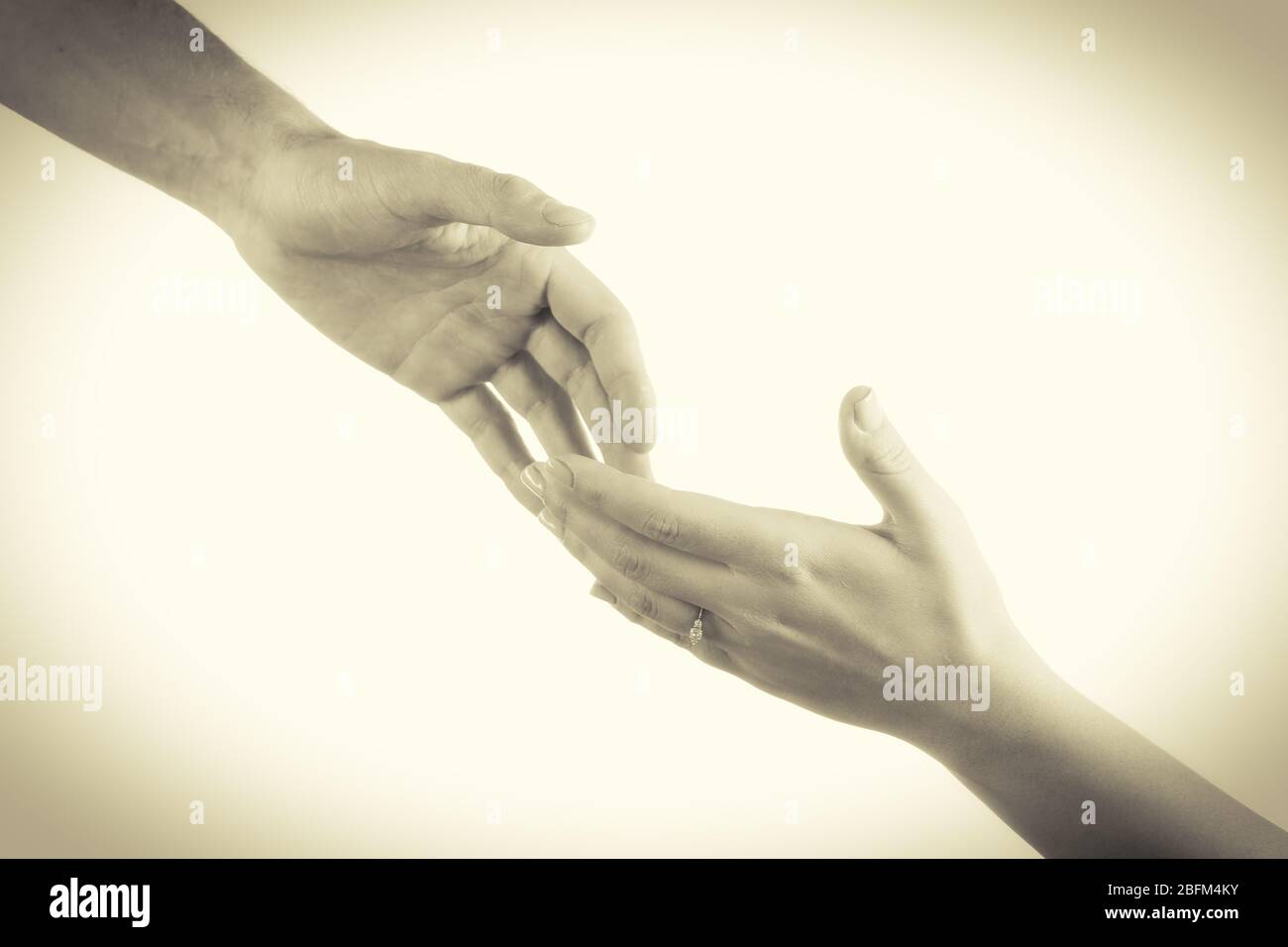Two hands reaching toward each other. Helping concept. Vintage tone ...