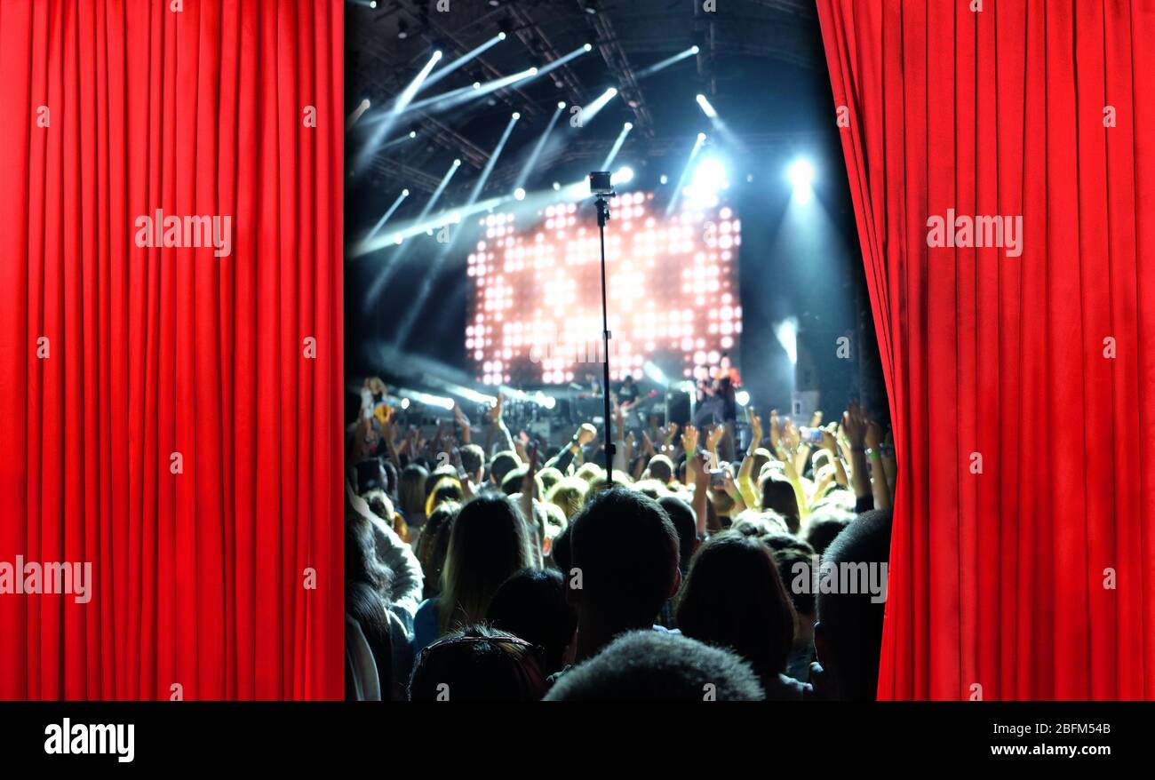 Red curtain on concert stage slightly open Stock Photo - Alamy