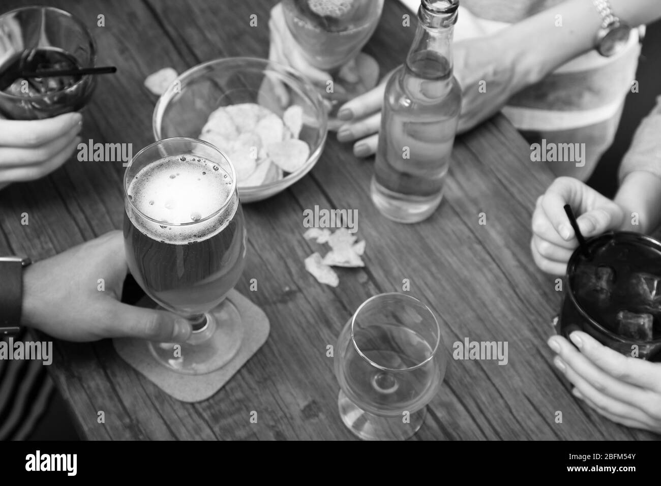View on friends having alcoholic drinks in the bar, close-up Stock ...