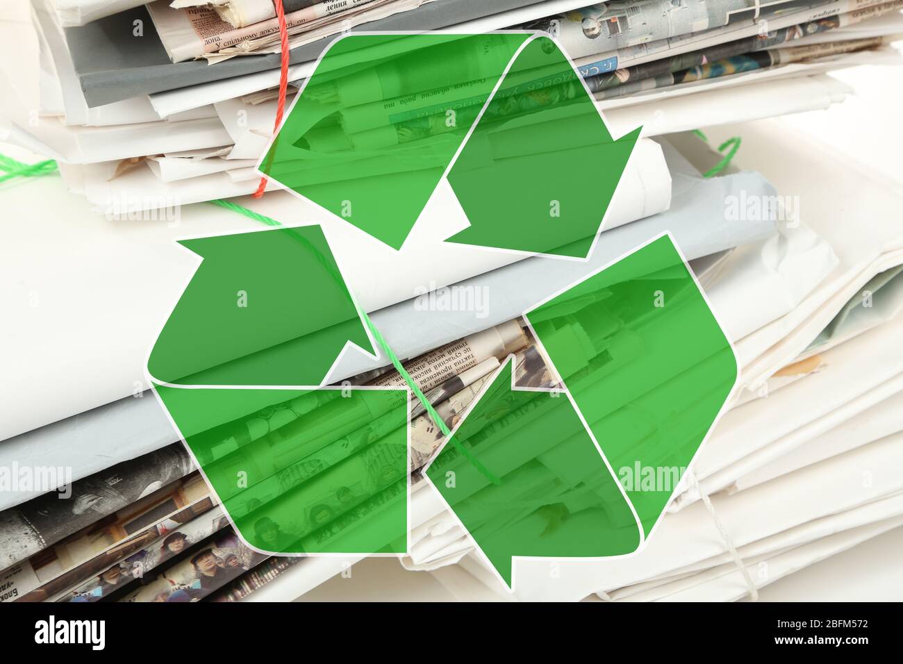 Big stack of papers and recycle sign Stock Photo - Alamy