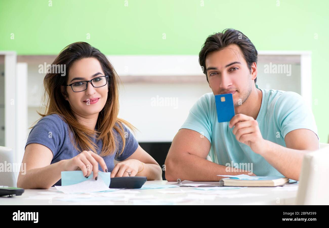 The young family struggling with personal finance Stock Photo - Alamy