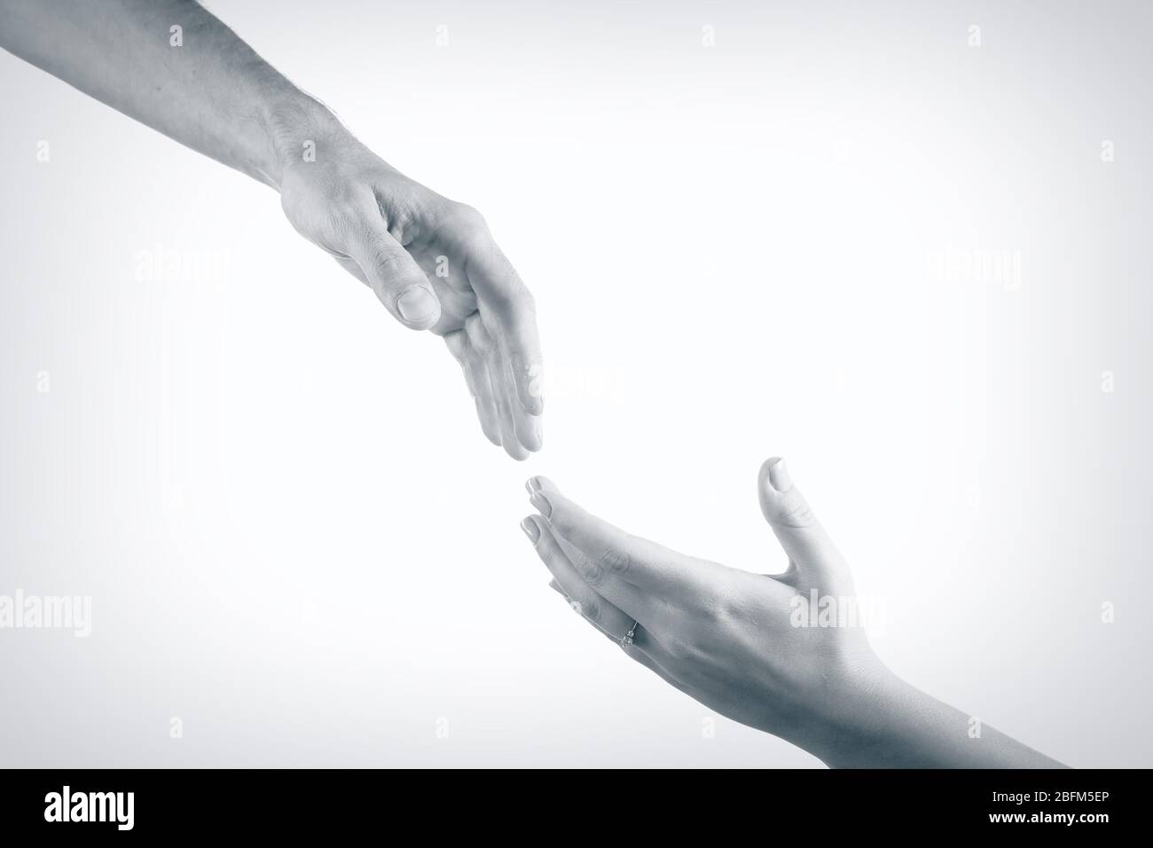 Two hands reaching toward each other. Helping concept. Vintage tone ...